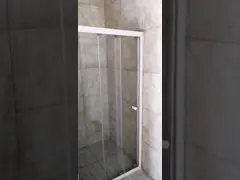 three door shower screen with white profile and knob handle