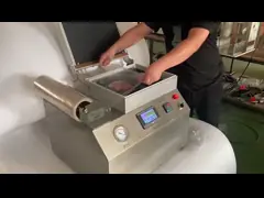 Semi-Automatic Tabletop Vacuum Skin Packaging Machine Packing Food in Tray