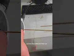 The eddy current flaw detector passes through the probe to inspect the copper rod manually