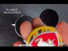 Embossed 3D Logo Screen Printed Soft Plating Golden TPU Badges for Cloth