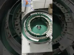 Two Vibratory Bowl Feeders Convey Parts together