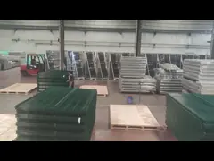 mesh and posts are being palletized for shipment