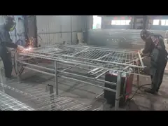 Fence mesh is being welded by workers