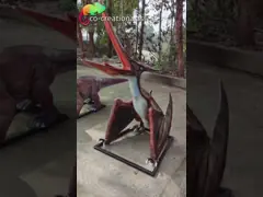 China 3D Fiberglass Realistic Looking Dinosaurs Struggled Pterosauria Statue Outdoor for sale