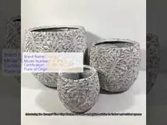 grey round fiber cement planter with a monstera leaf design pattern lightweight durable low-maintainence flower pot holiday Villa office decoration Rooftop Gardens landscaping project