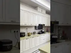 China Classic French Kitchen Cabinets With Elegant Curved Displays And Functional Island for sale