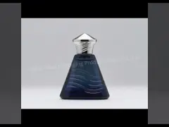 China Custom Blue Glass Perfume Bottle 30ml with 4.6cm Outer Diameter and Wave Relief Design for Luxury Fragrance Packaging for sale
