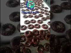 donut with chocolate coating and nuts decoration