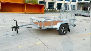 China Wooden Board Utility Cargo Trailer 1500KG ATM Hot-Dip Galvanized Steel Construction with Foldable Platform for sale