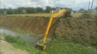 Excavator with long reach boom and Screening Bucket