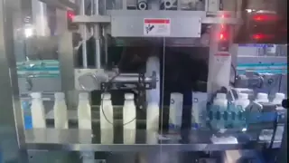 A Closer Look: Filled Milk Bottle Steam Sleeve Shirnking Machine With Brushing Device