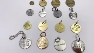 China Oval Engraved Metal Key Tags Purse Metal Logo Charms Corrosion Resistant for sale