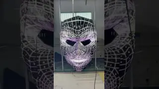 The mask-shaped LED display dynamically bends to present high-definition images and smooth animation