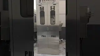 Enclosed emergency shower and eyewash