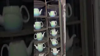 White ceramic teapot with vacuum coating and film layer applied