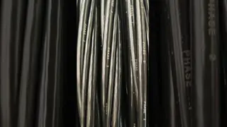 Aerial bundled cable core identification via ribs and laser printing figure