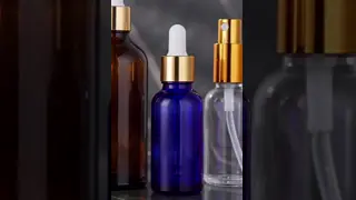 Round shoulder cosmetic glass bottle