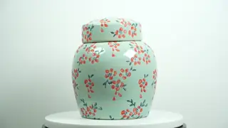 Glossy Green Ceramic Urn with Floral Berry Motif