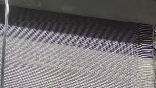 Stainless steel wire mesh is being manufactured and processed in the factory workshop.