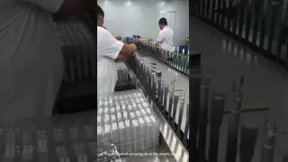 process of spraying oil on the plastic casing