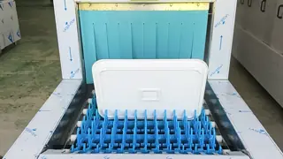 Commercial dishwasher large plate cleaning test in progress