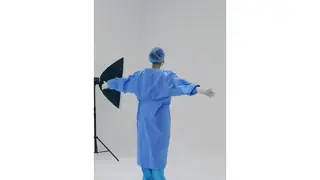 Knitted sleeve surgical gown