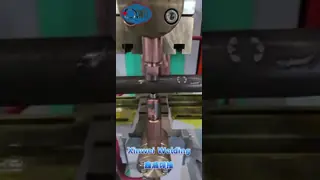 Welding nut to tube with spot and projection welding machine