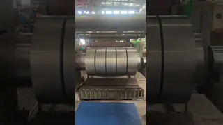 Steel coil leveling in progress