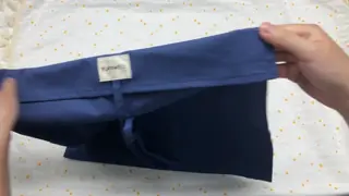 dark blue canvas envelope pouch with fabric label