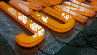Custom Orange Front & Side Lit Acrylic Channel Letters | Factory Direct LED Signage