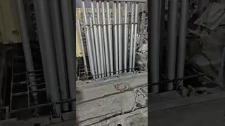Aluminum billet hanging from the casting pit