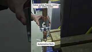 Metal Nuts Are Precisely Spot Welded with a Vertical Medium-Frequency Inverter Welder