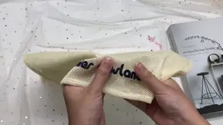 beige nylon mesh drawstring bag