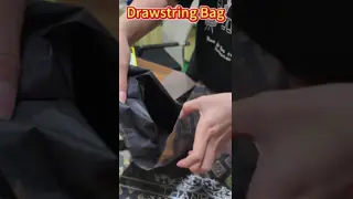 It can hang, and be mounted on a vehicle to carry garbage.