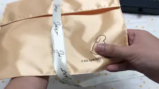 light yellow satin envelope pouch with ribbon