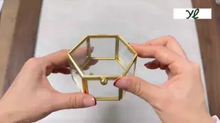 gold hexagonal metal glass jewelry box with hinged lid